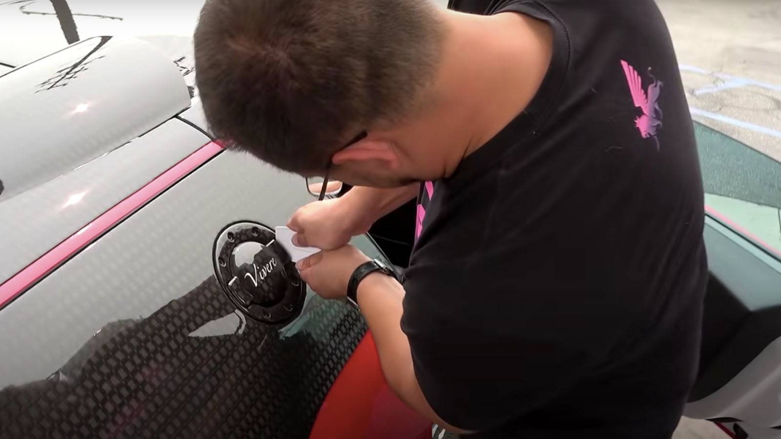 Watch This Mansory Bugatti Veyron Owner Struggle To Get His Gas Cap Open